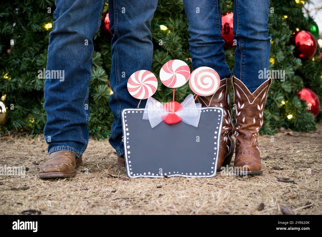 Western Holiday Scene with Cowboy Boots, Chalkboard, and Festive ...
