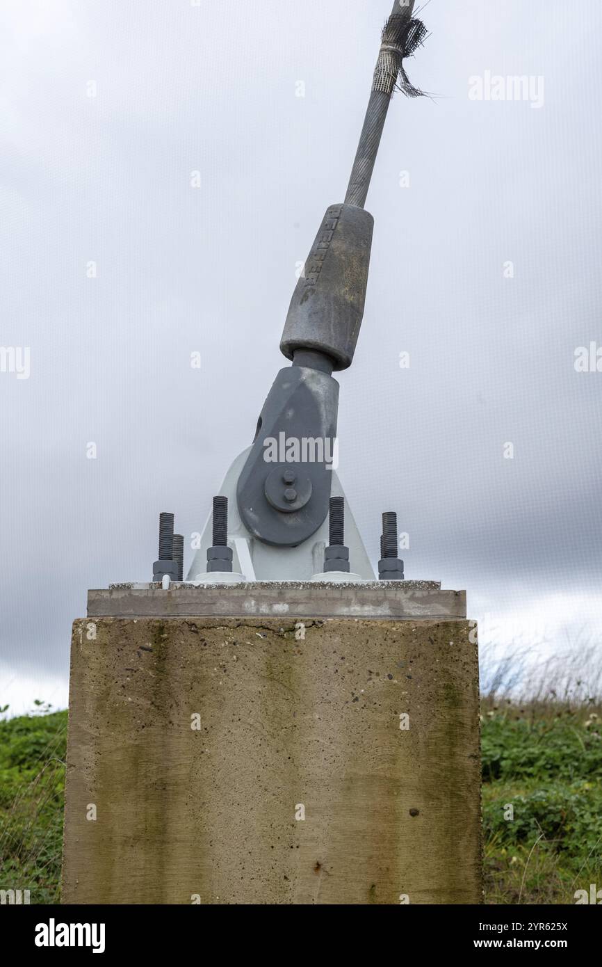 Rope tensioned in concrete Stock Photo - Alamy