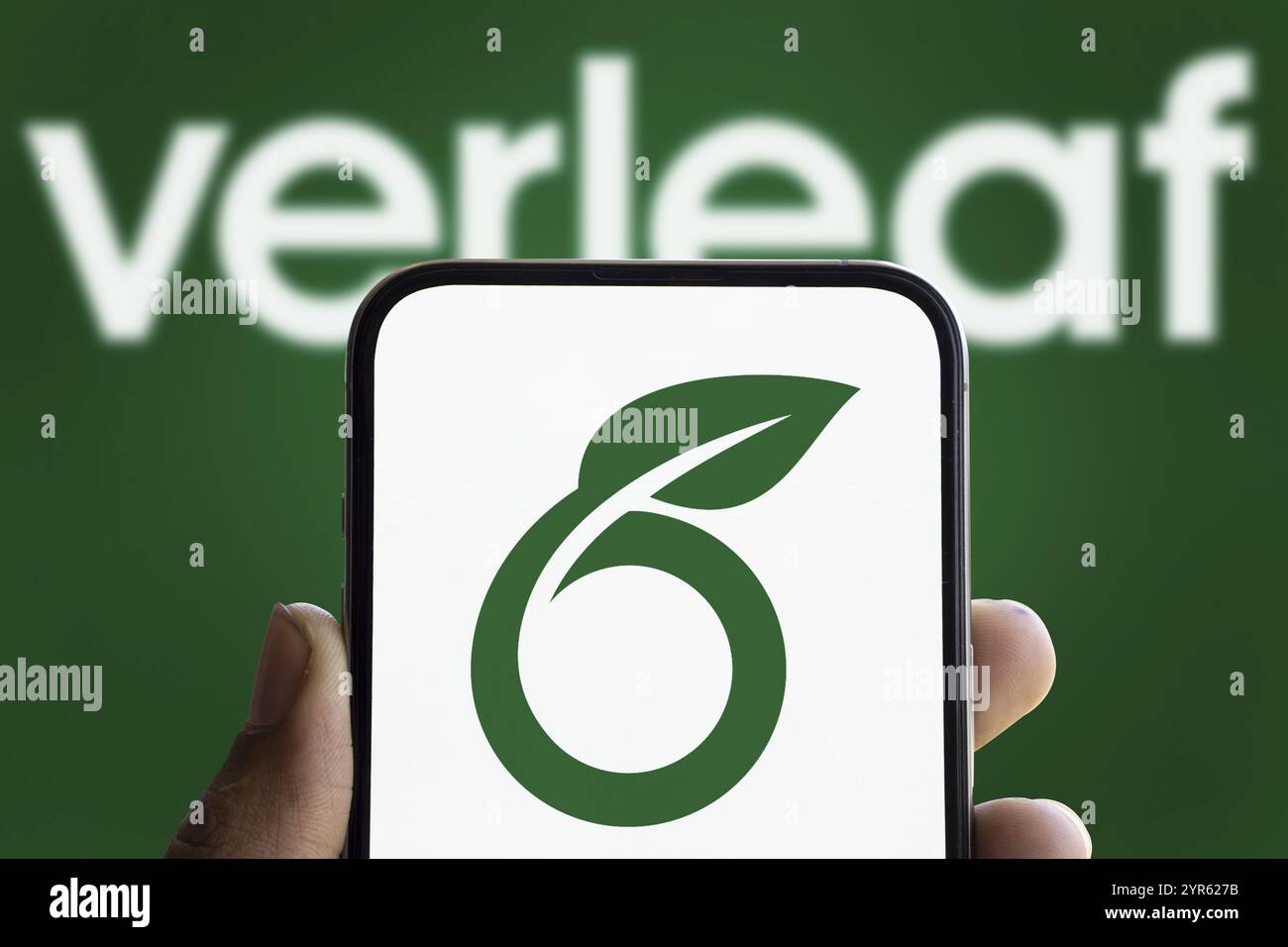 Overleaf logo is displayed on smartphone. Overleaf is a cloud-based ...