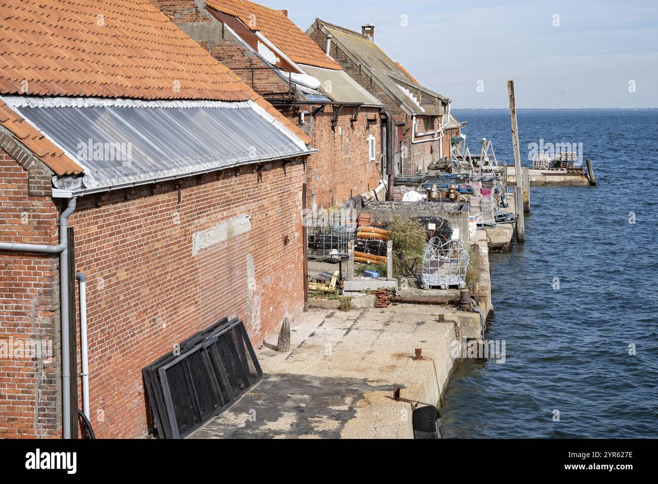 Small warehouses view of the port Stock Photo - Alamy