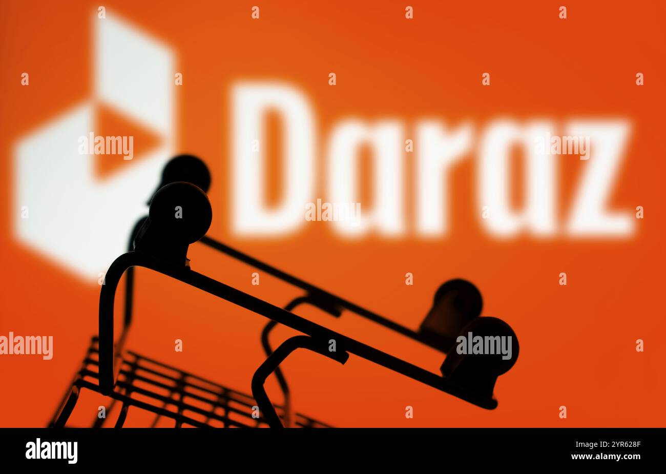 A silhouette of a shopping cart is in front of Daraz Stock Photo - Alamy