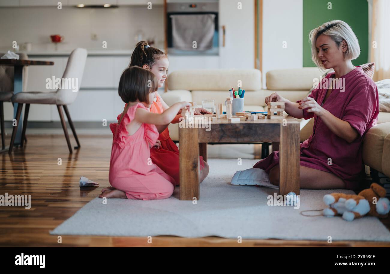Family bonding time with kids playing games at home Stock Photo - Alamy