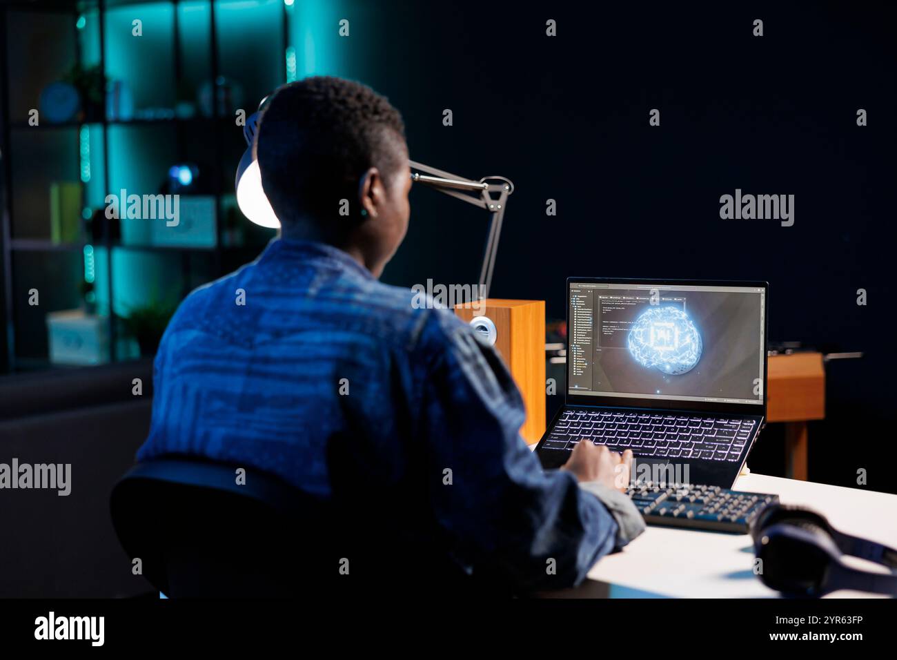 African American developer manages futuristic database with artificial intelligence. Black woman ...