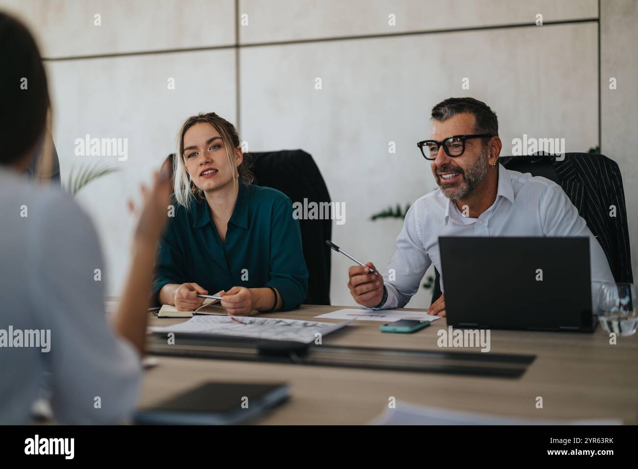 Multicultural business team engaged in an office meeting discussion ...