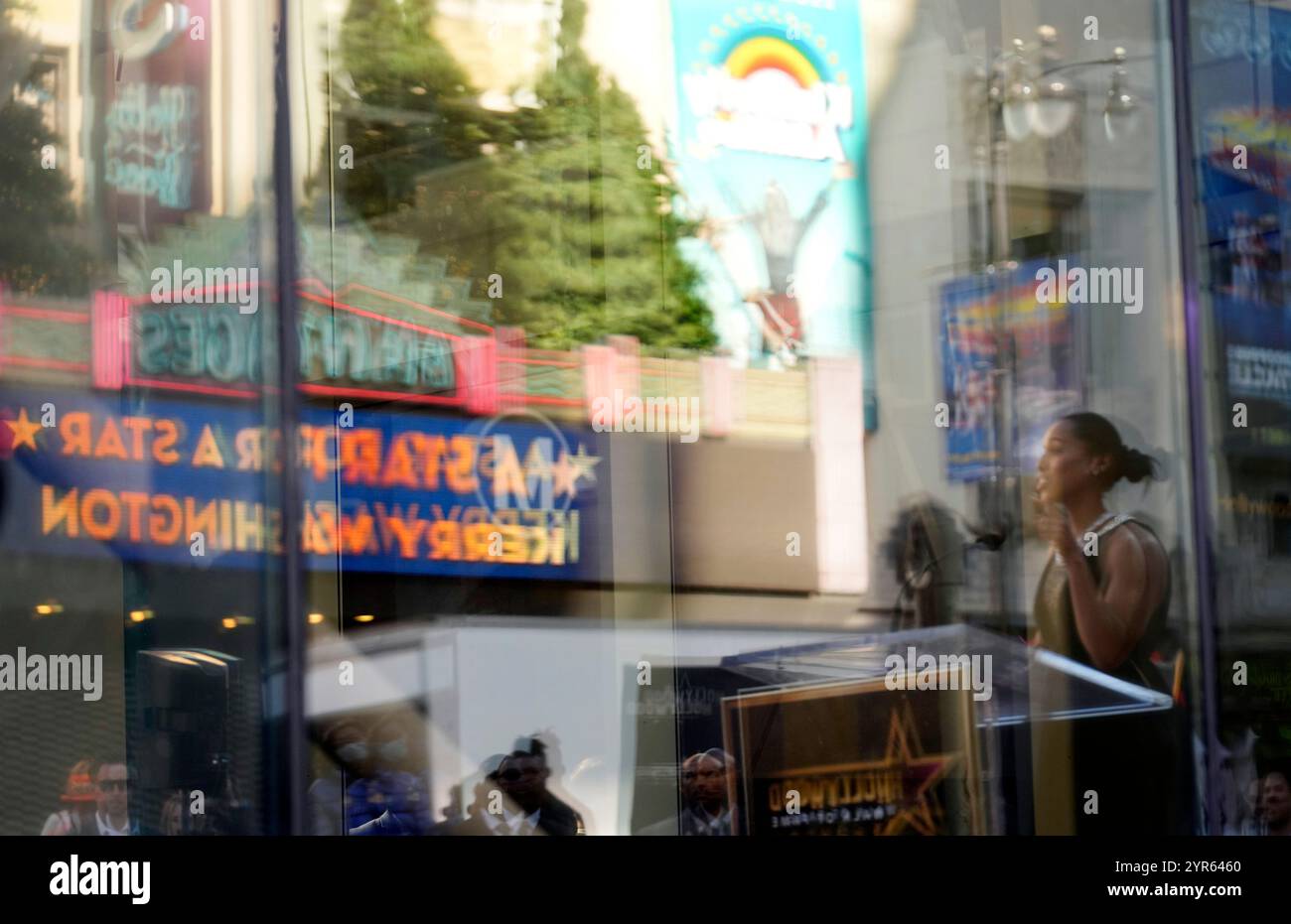 Actor Kerry Washington, right, is reflected in a window as she delivers ...
