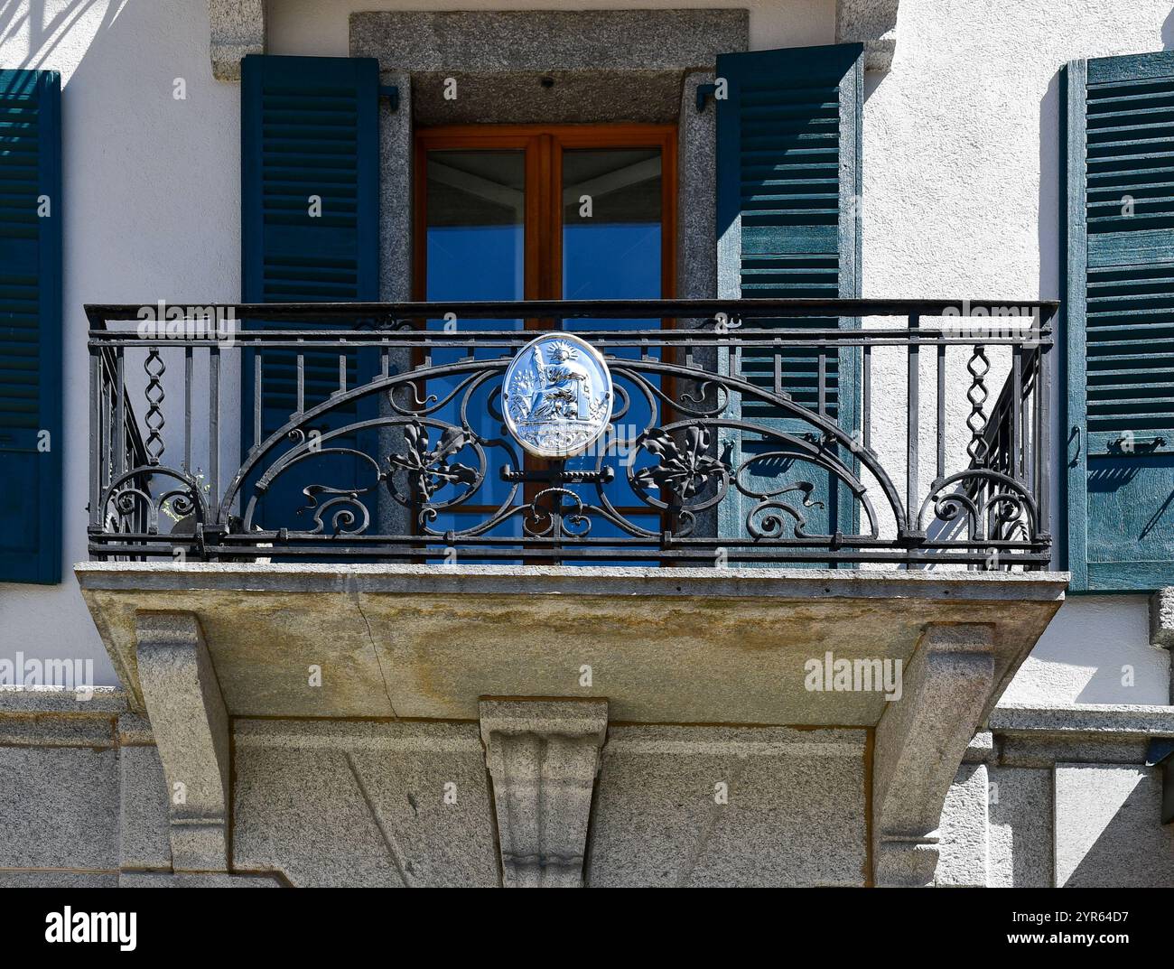 Balcony of an old palace decorated with a metal plaque depicting the ...