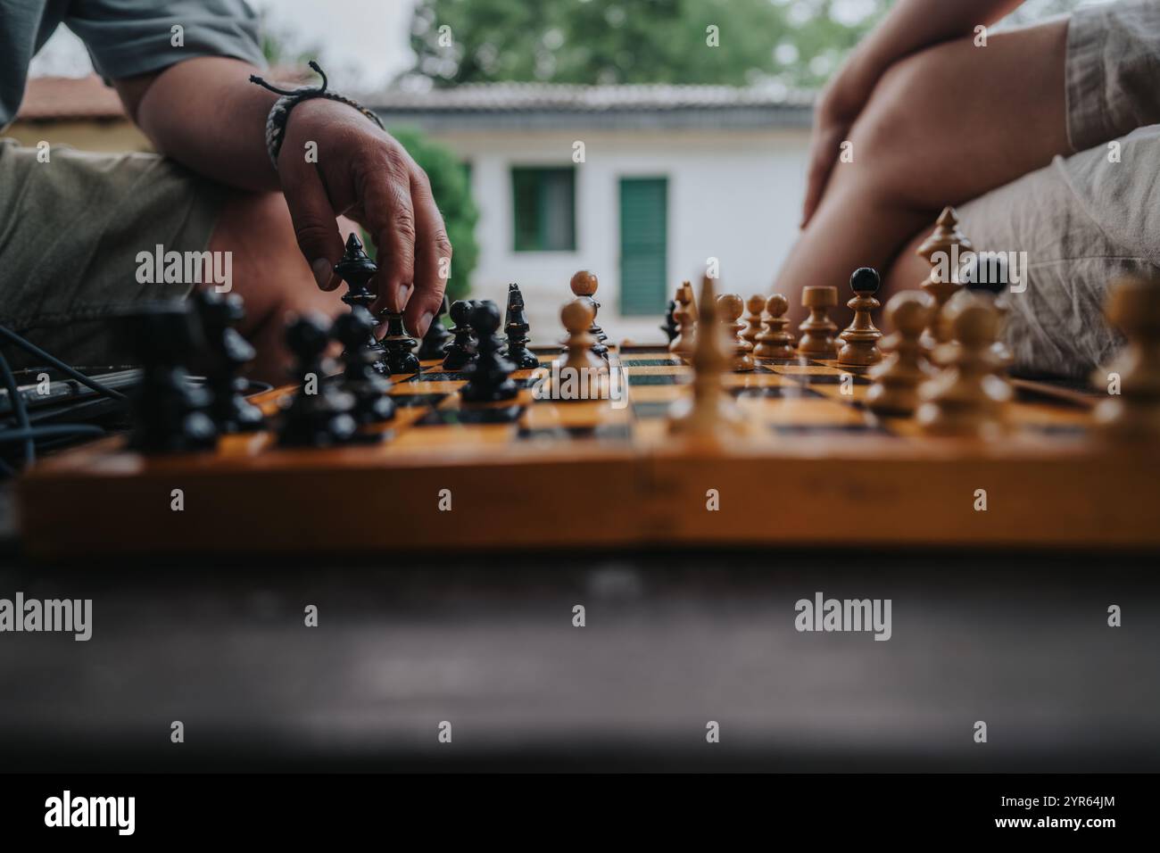 Two people playing an intense game of chess outdoors Stock Photo - Alamy