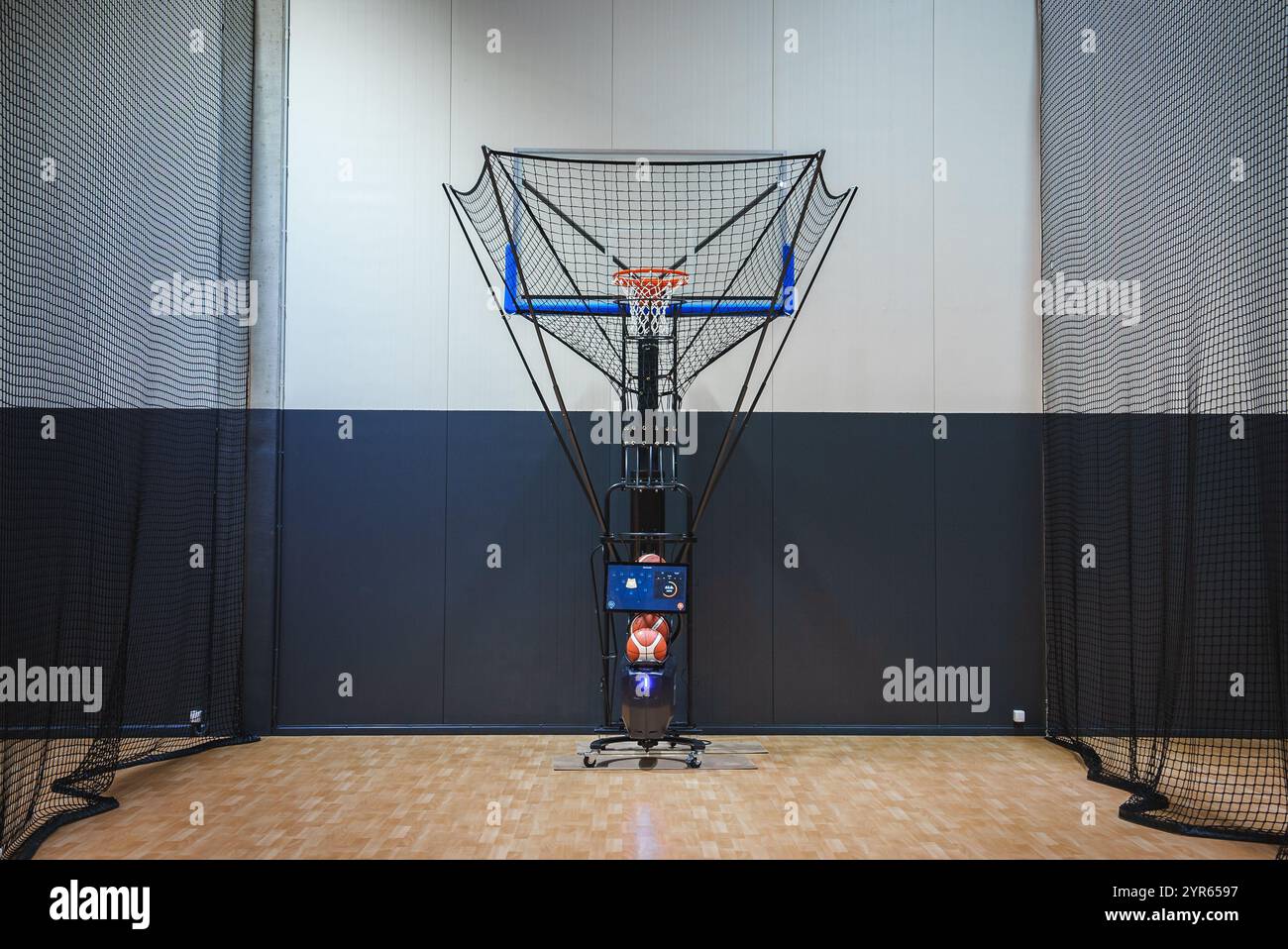 Indoor Basketball Court with Modern Shooting Machine Stock Photo - Alamy