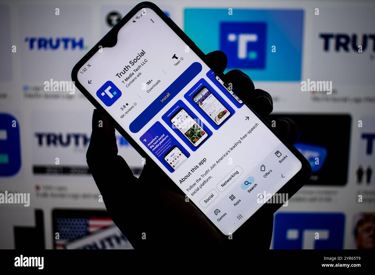 SEATTLE, WA, USA - APR 3, 2025: A man holds smartphone with Truth ...