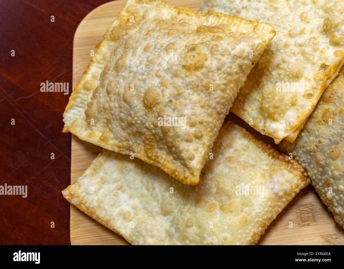 Traditional Brazilian fried pastry stuffed with ground beef. "Pastel de ...