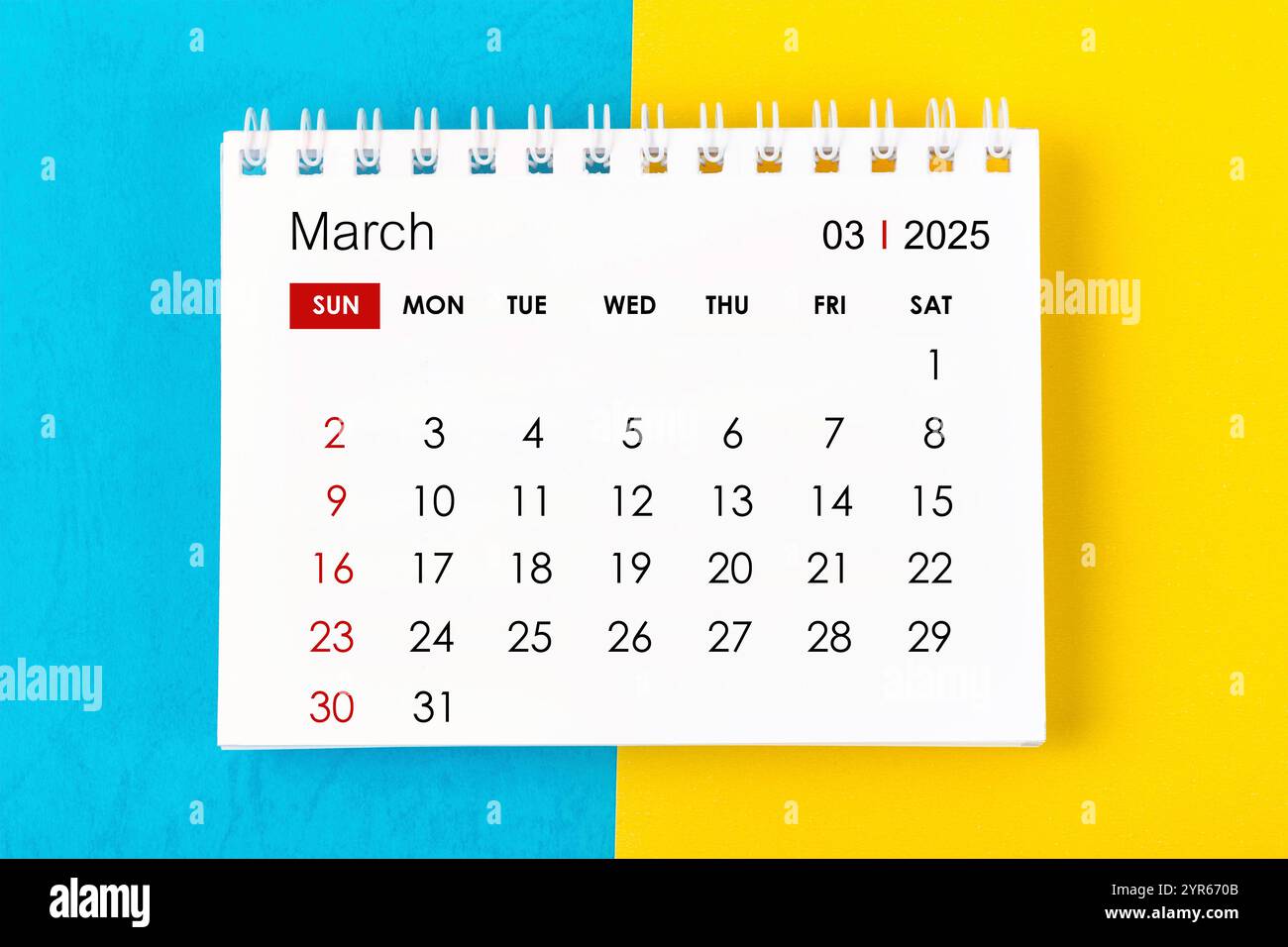 March 2025 Monthly desk calendar for 2025 year on blue and yellow ...