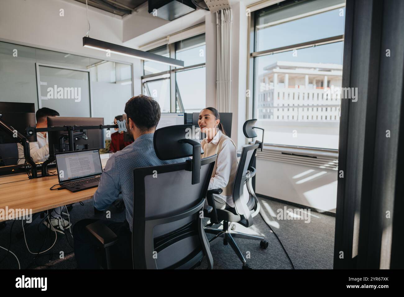 Business employees collaborating in a modern office environment Stock ...