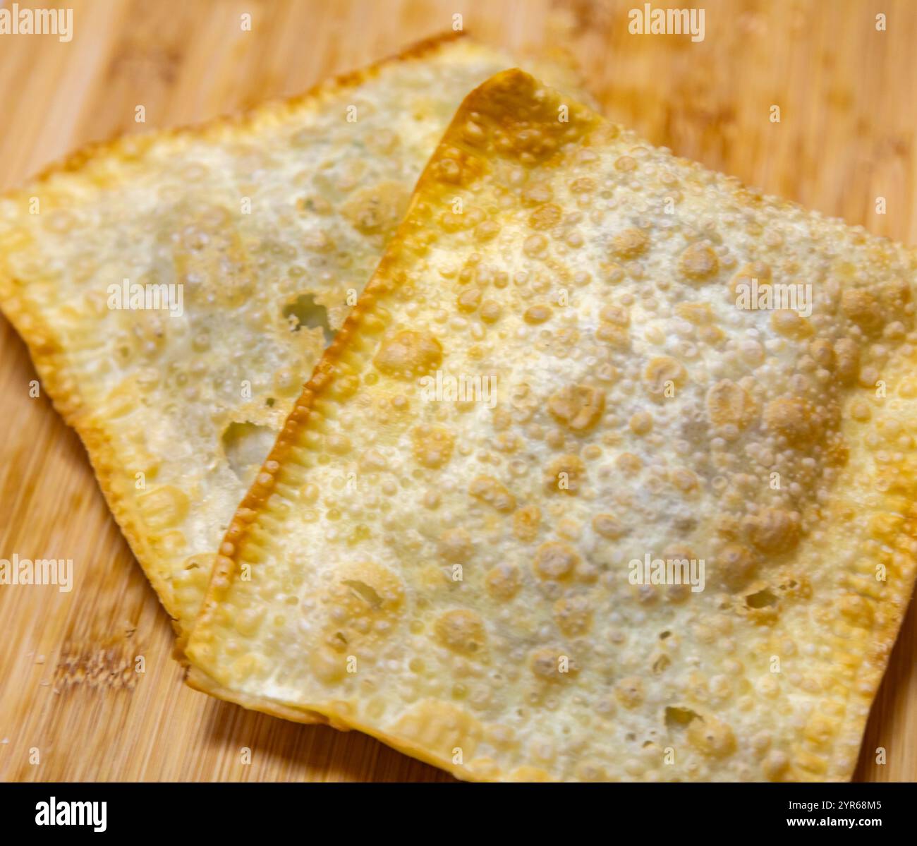 Traditional Brazilian fried pastry stuffed with ground beef. "Pastel de ...