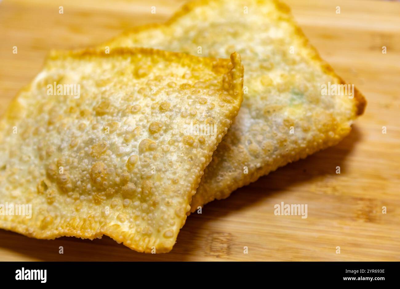 Traditional Brazilian fried pastry stuffed with ground beef. "Pastel de ...