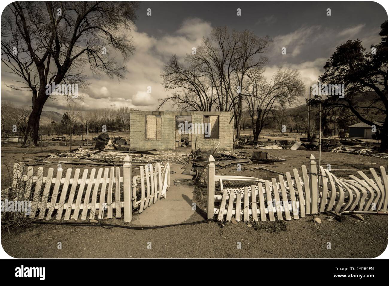 APRIL 2021, ARIZONA, USA -sad looking deserted home and white picket ...