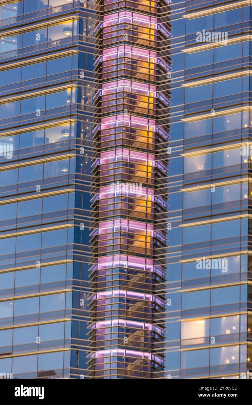 The building is very tall and narrow, with clear windows that allow for ...