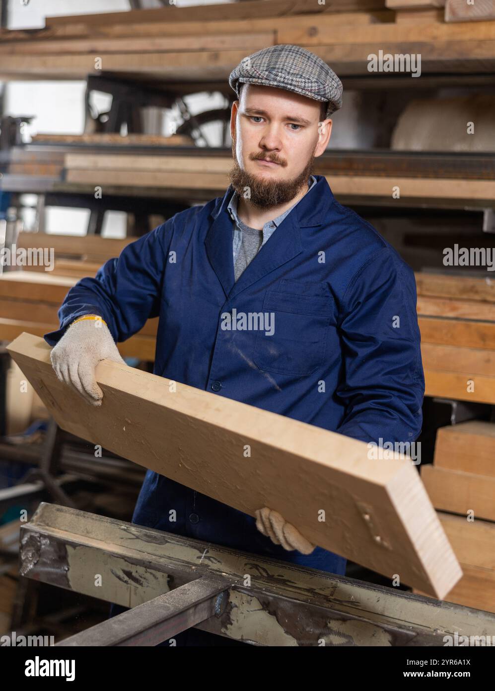 Factory worker putting material machine hi-res stock photography and ...