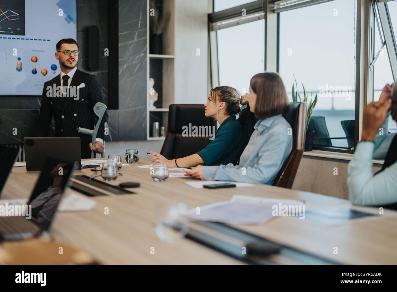 Multicultural business team in an engaging meeting presentation Stock ...