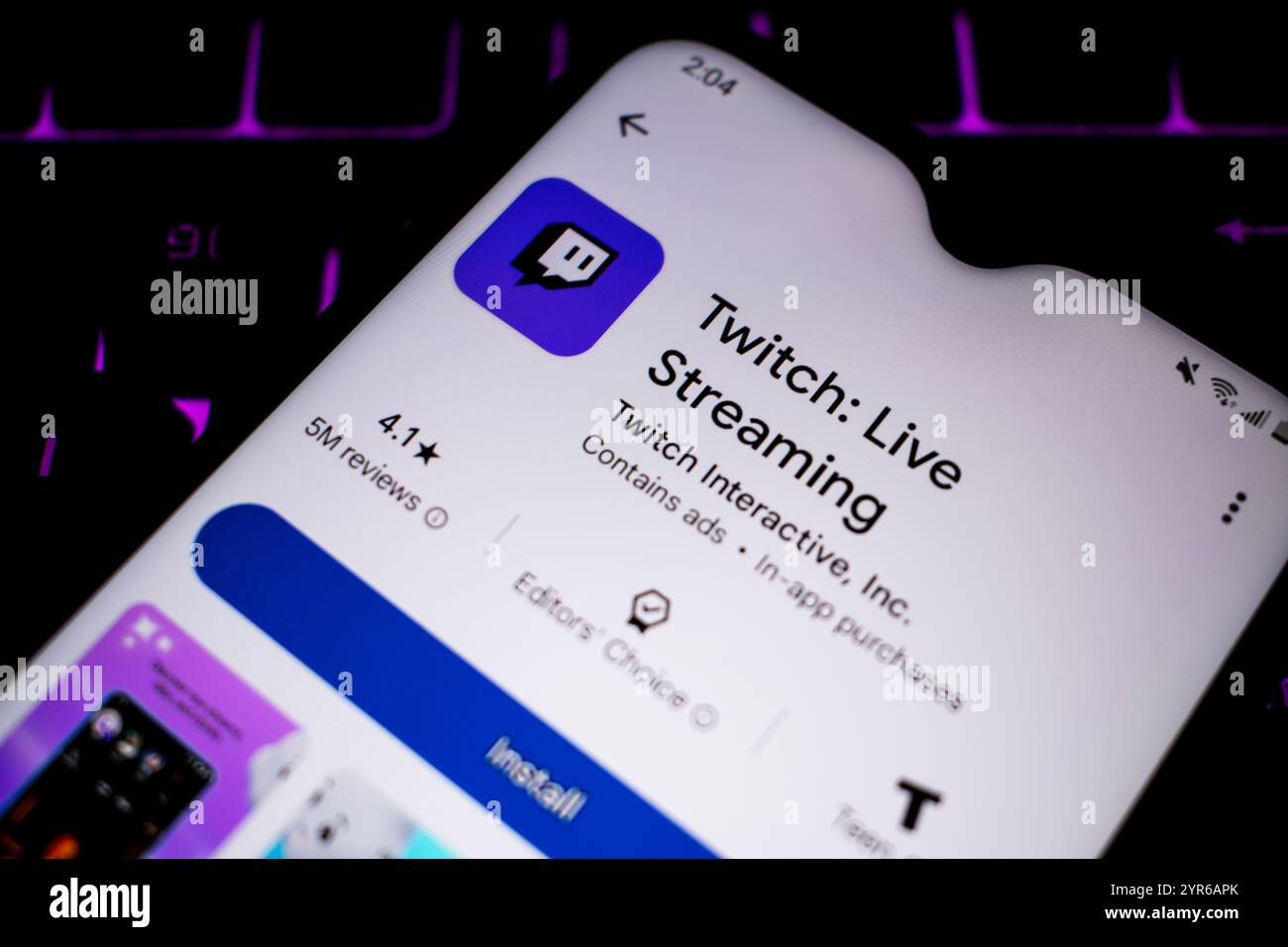 SEATTLE, WA, USA - APR 3, 2025: A man holds smartphone with Twitch app ...