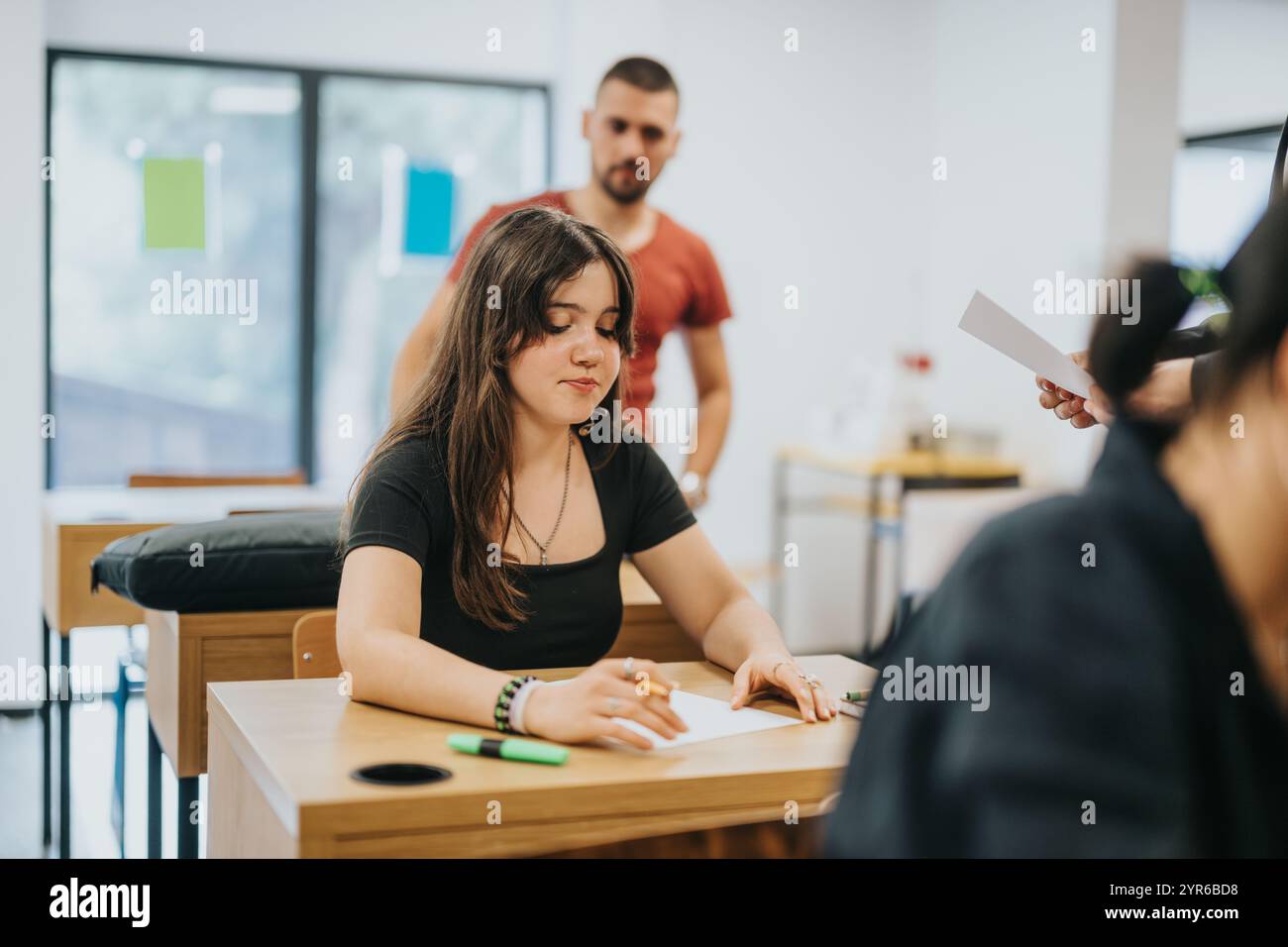 High school students focused during classroom lesson at school desks ...