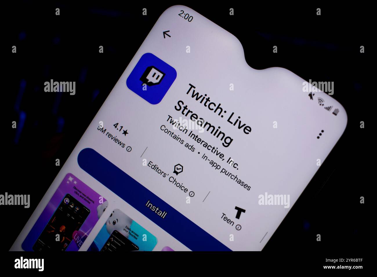 SEATTLE, WA, USA - APR 3, 2025: A man holds smartphone with Twitch app ...