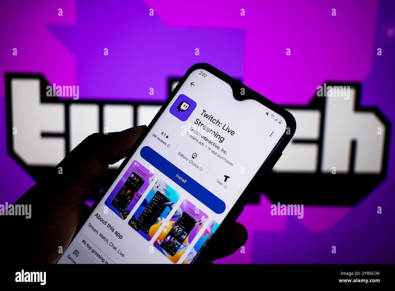 SEATTLE, WA, USA - APR 3, 2025: A man holds smartphone with Twitch app ...