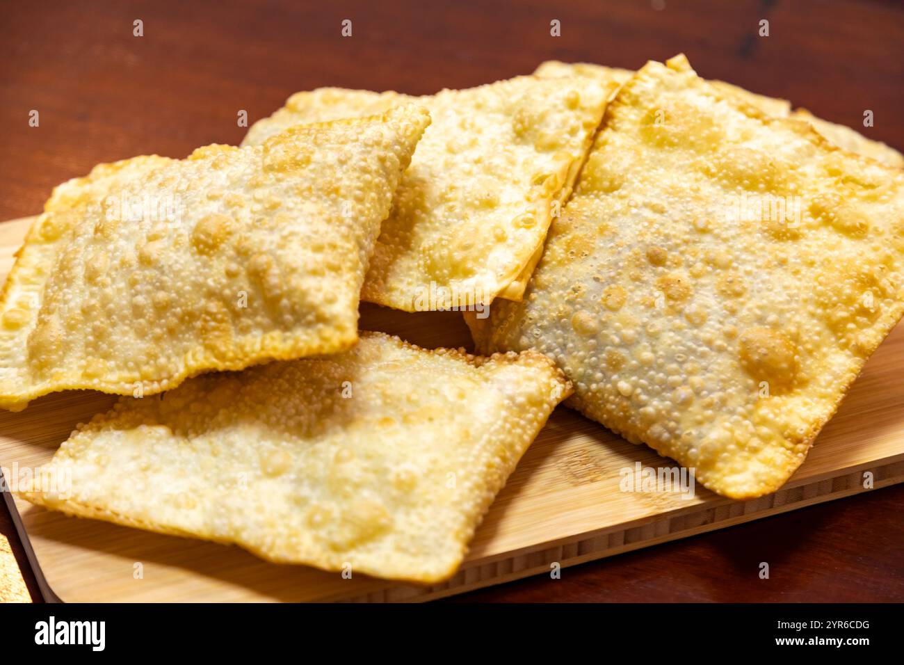 Traditional Brazilian fried pastry stuffed with ground beef. "Pastel de ...