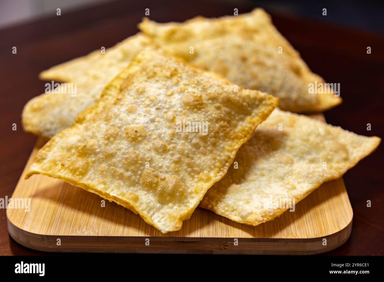Traditional Brazilian fried pastry stuffed with ground beef. "Pastel de ...