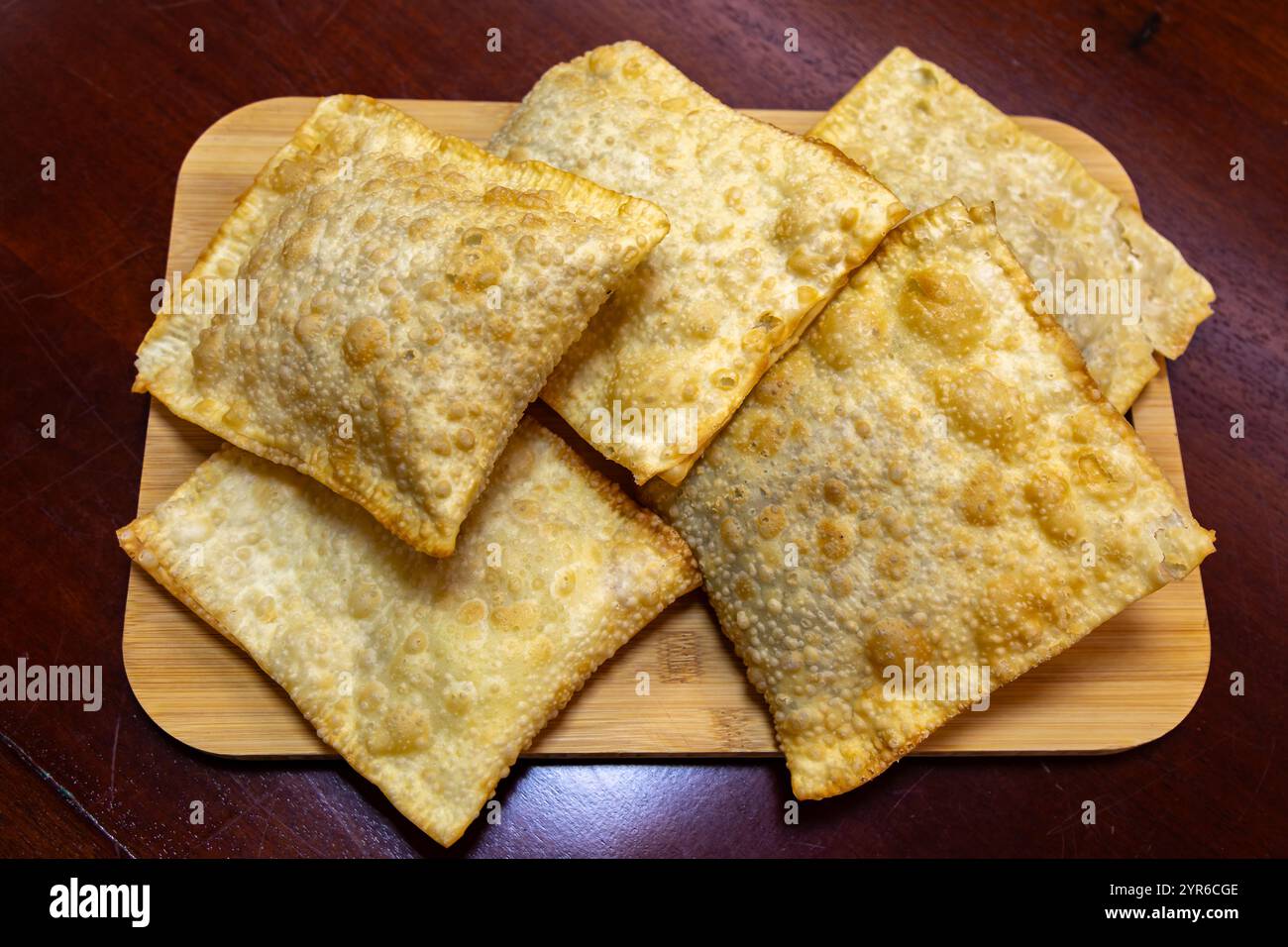 Traditional Brazilian fried pastry stuffed with ground beef. "Pastel de ...