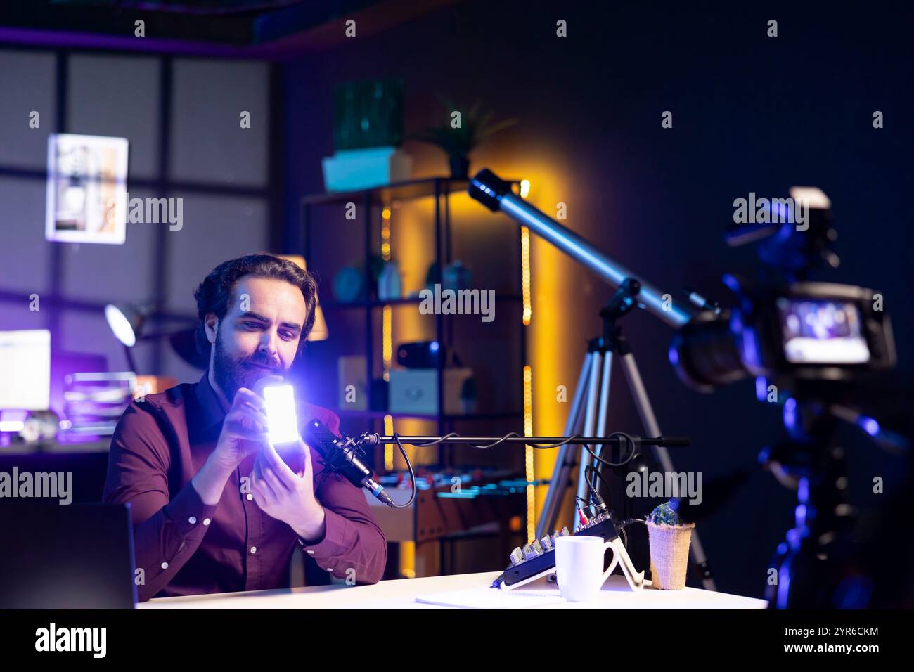 Influencer presenting viewers mini led lights during live broadcast ...