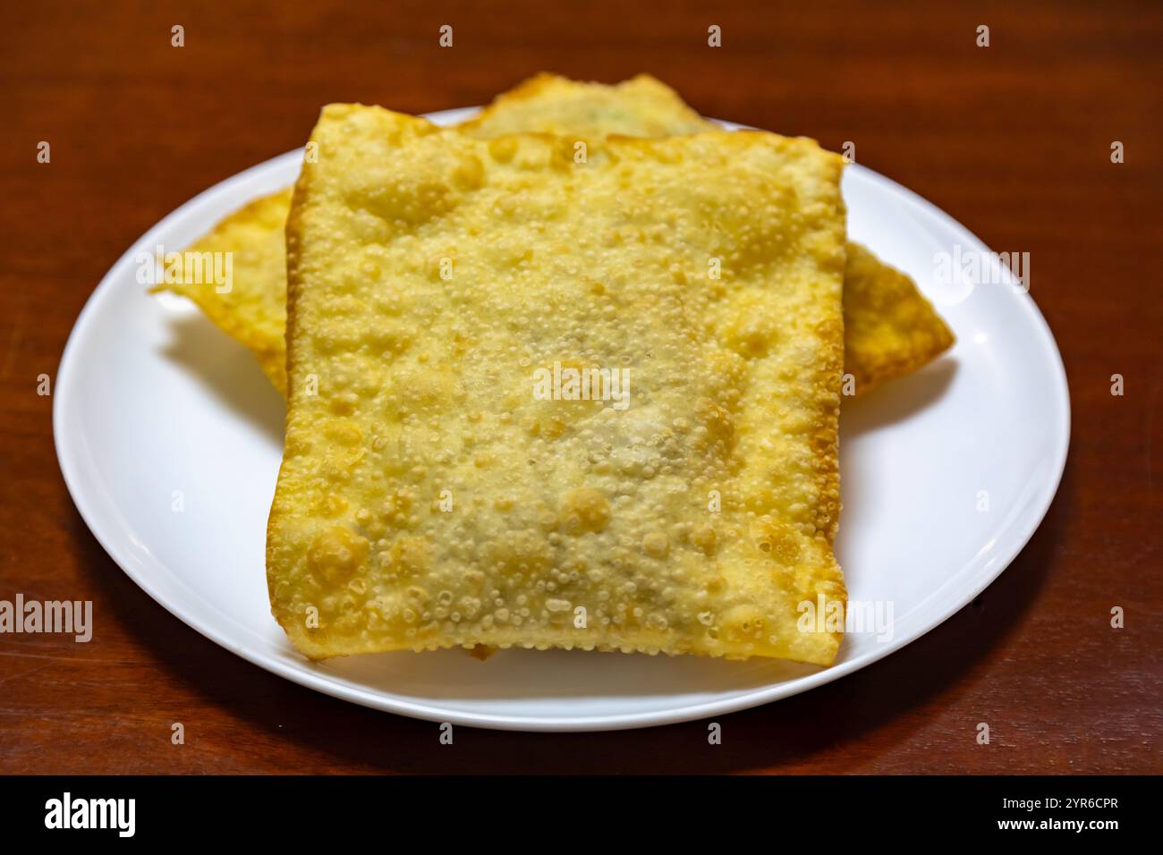 Traditional Brazilian fried pastry stuffed with ground beef. "Pastel de ...