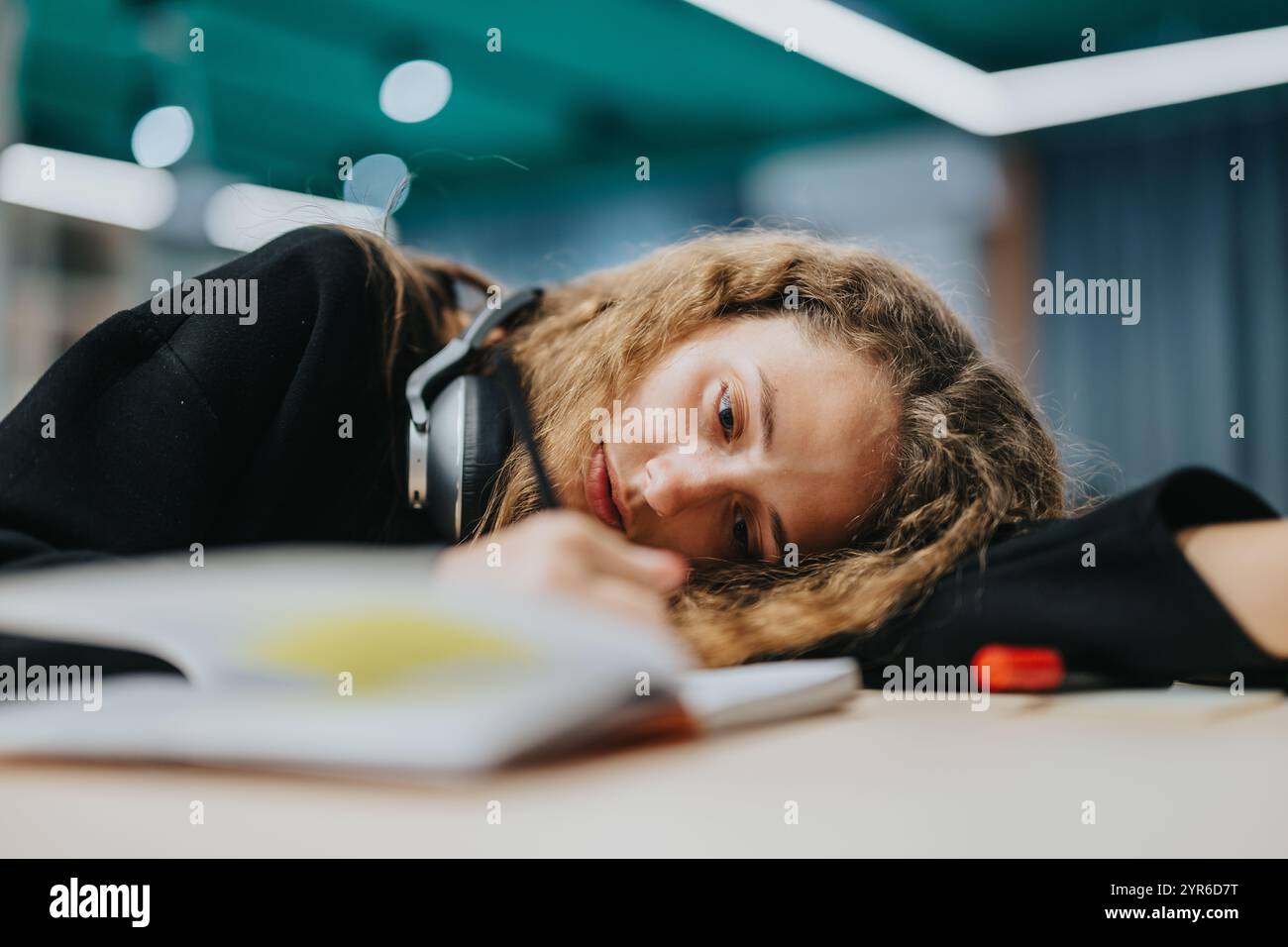 High school student looking tired in a classroom setting Stock Photo ...