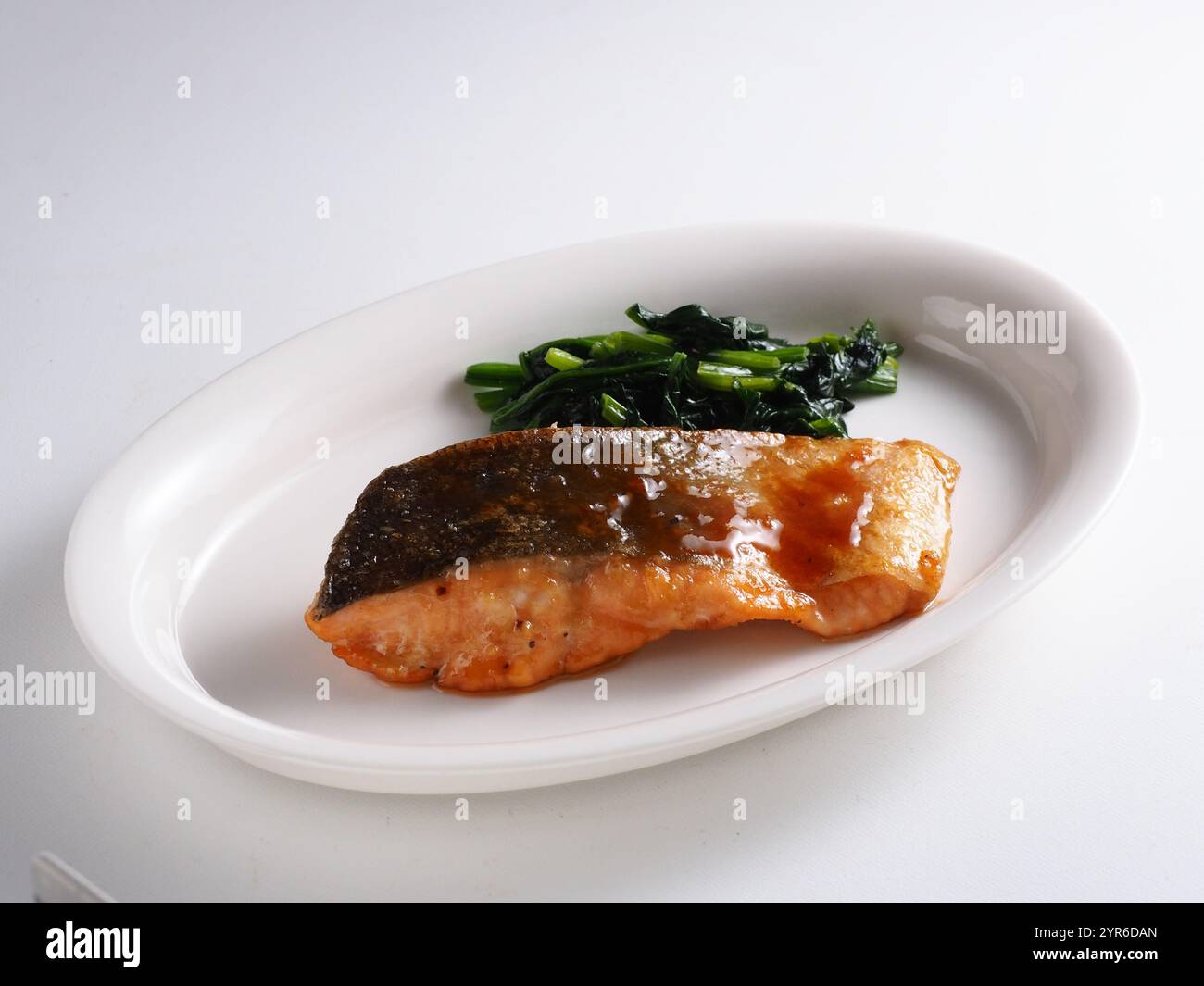 Sauteed silver salmon with spinach Stock Photo - Alamy