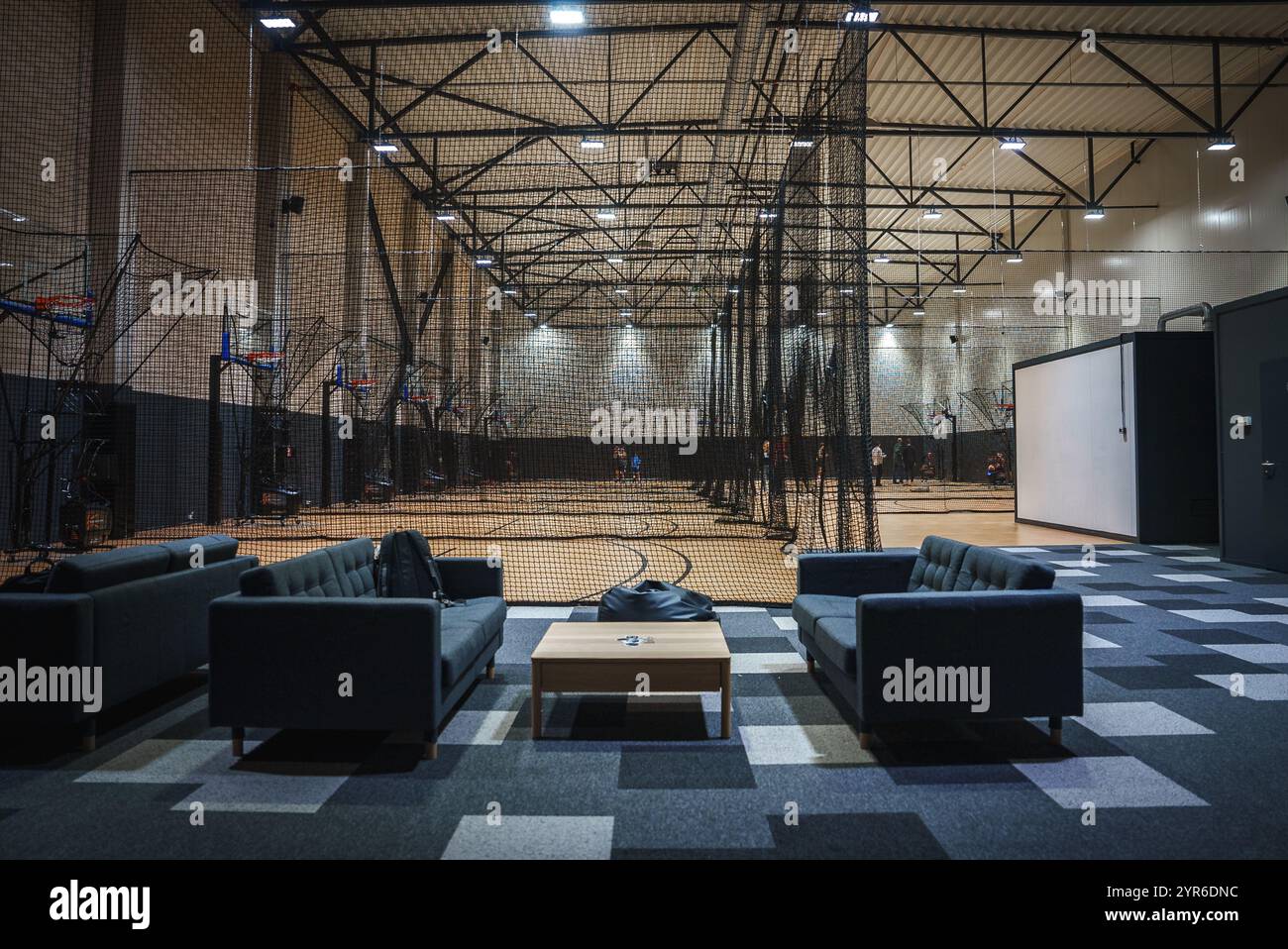 Indoor Basketball Facility with Multiple Courts and Seating Area Stock ...