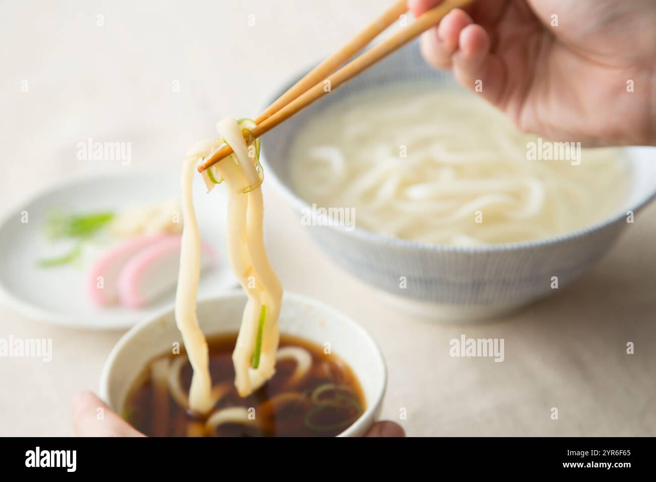 Scene of eating udon with hot water dipped in sauce Stock Photo - Alamy