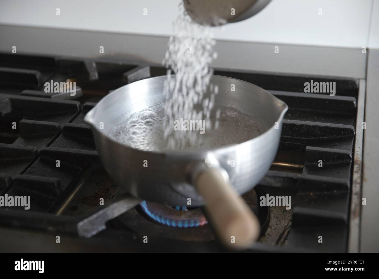 Dissolving thread agar and adding white sugar Stock Photo - Alamy
