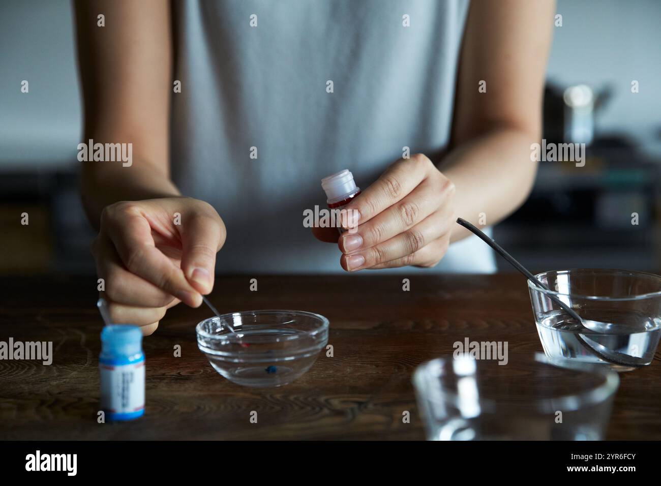 Person putting food in bowl hi-res stock photography and images - Alamy