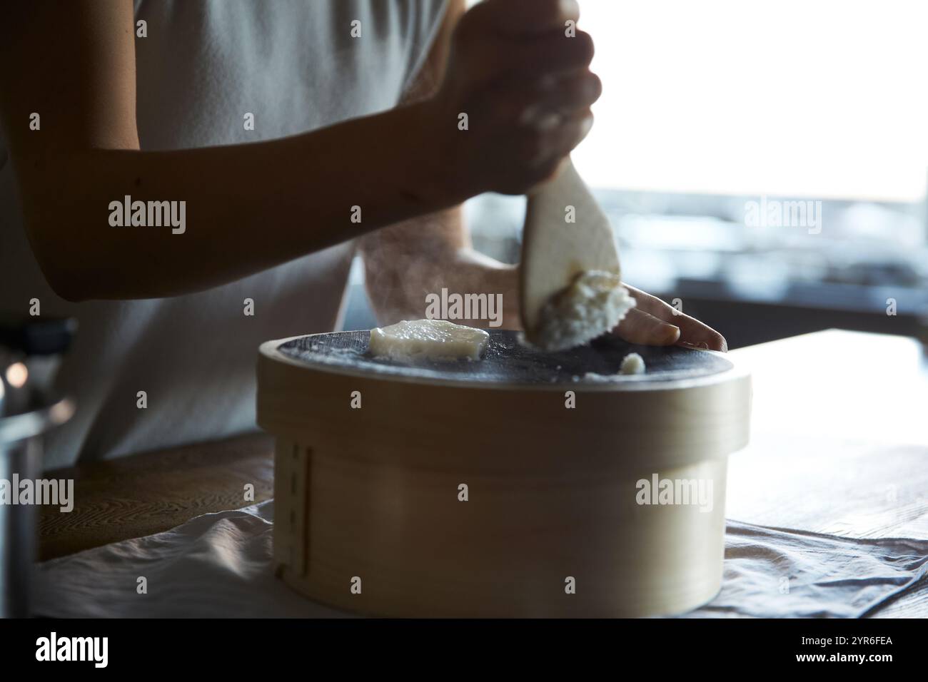 Steamed yams are strained through a strainer 1 Stock Photo - Alamy