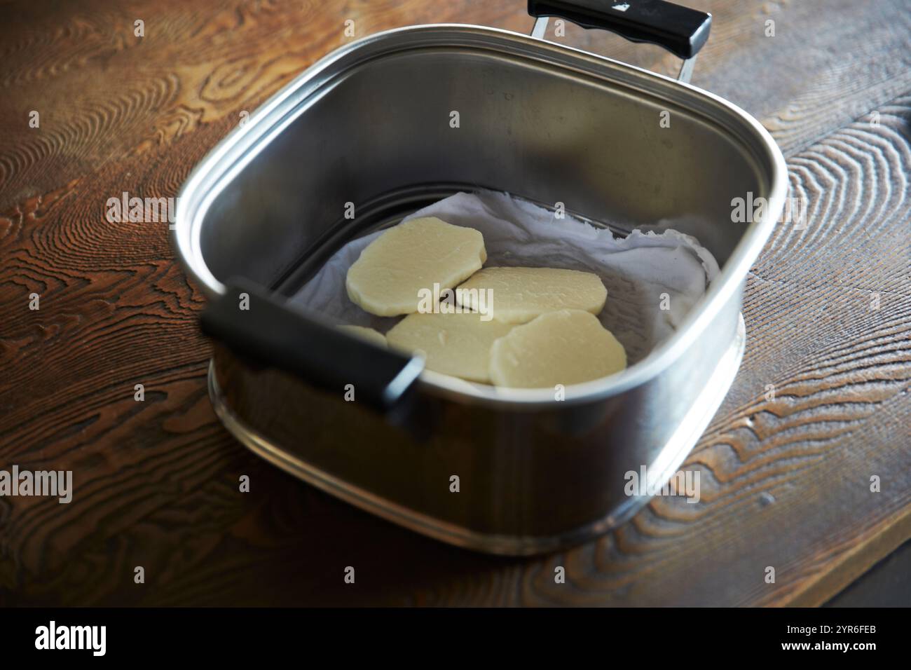 Put the yam in a steamer Stock Photo - Alamy