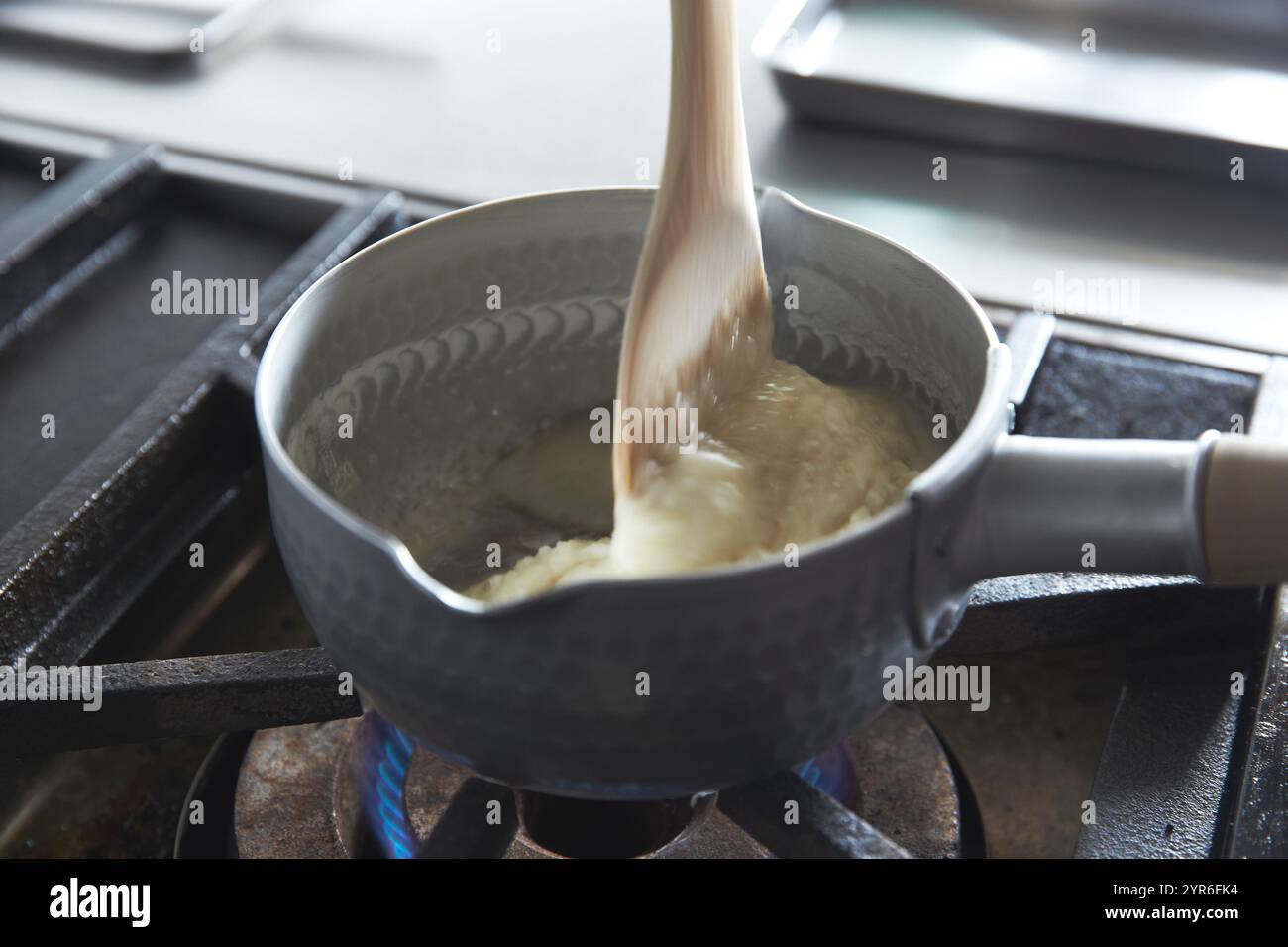 Cooking white bean paste Stock Photo - Alamy