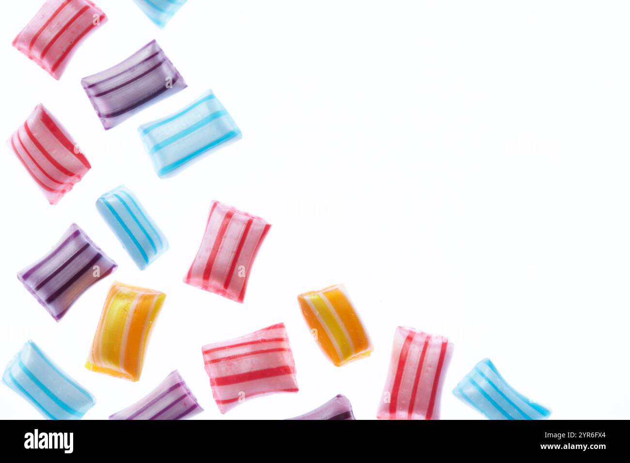 Scattered colourful candies Stock Photo - Alamy