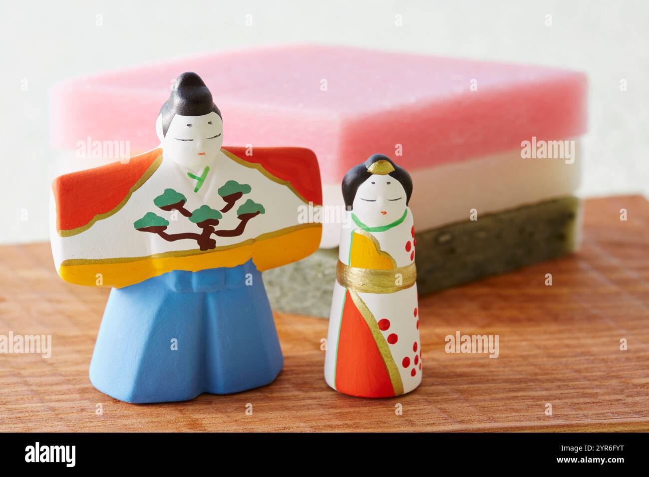 Hina dolls standing in front of water chestnut mochi Stock Photo - Alamy