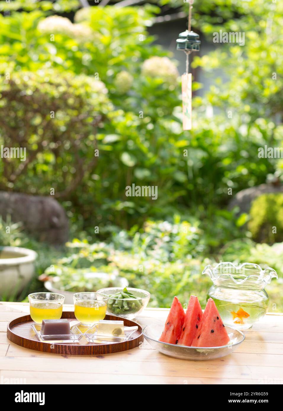 Wind chime, goldfish bowl, water melon, cold tea and mizuyokan on the ...