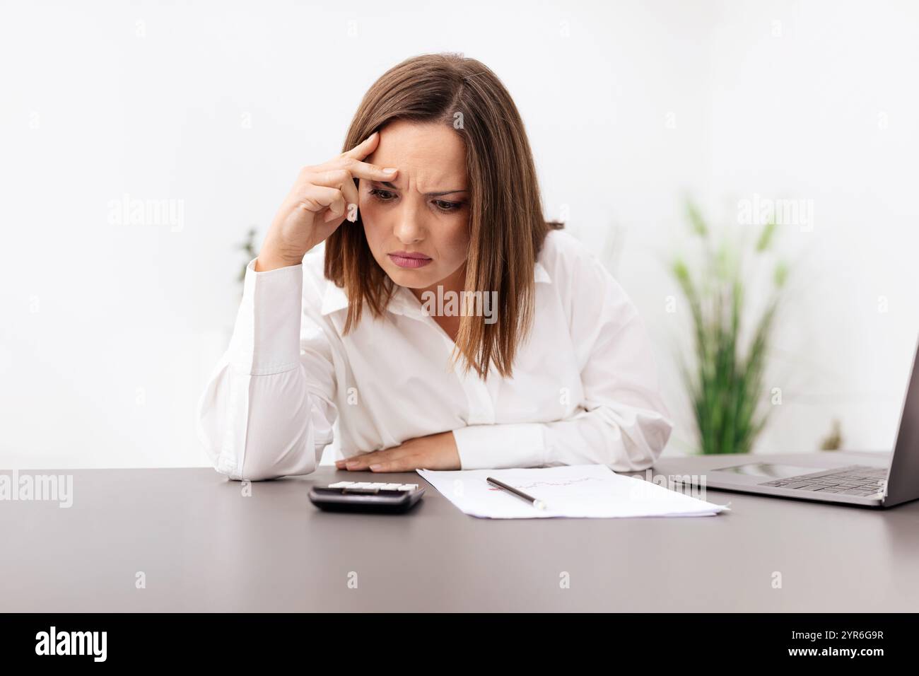 Women in corporate setting facing challenges with technology during ...