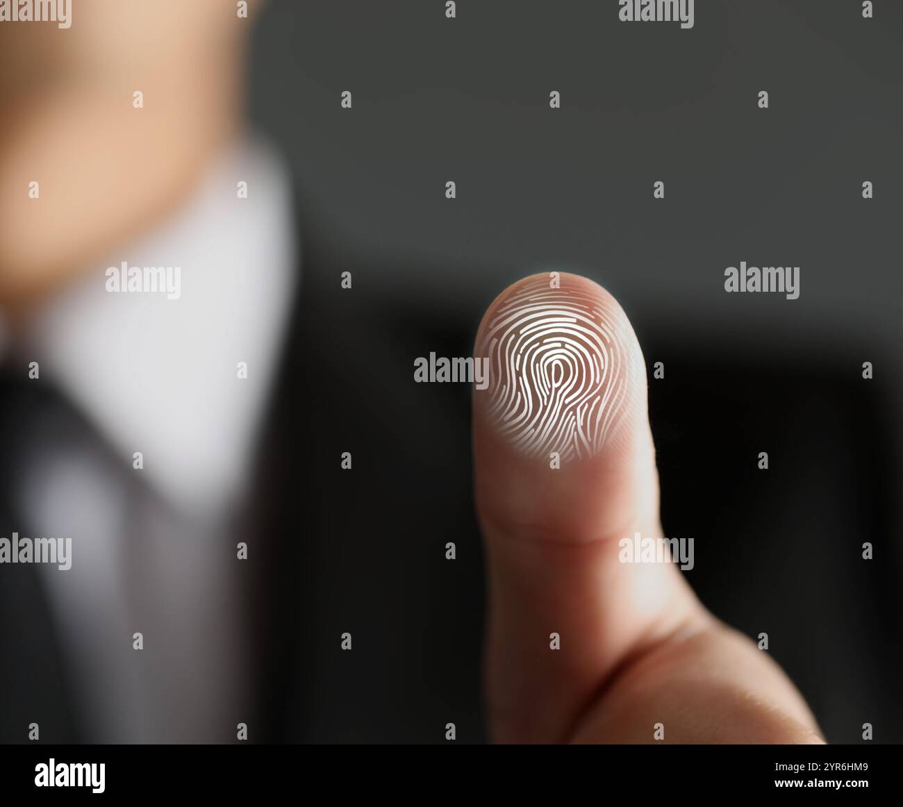Man pressing finger to surface showing friction ridges pattern, closeup ...