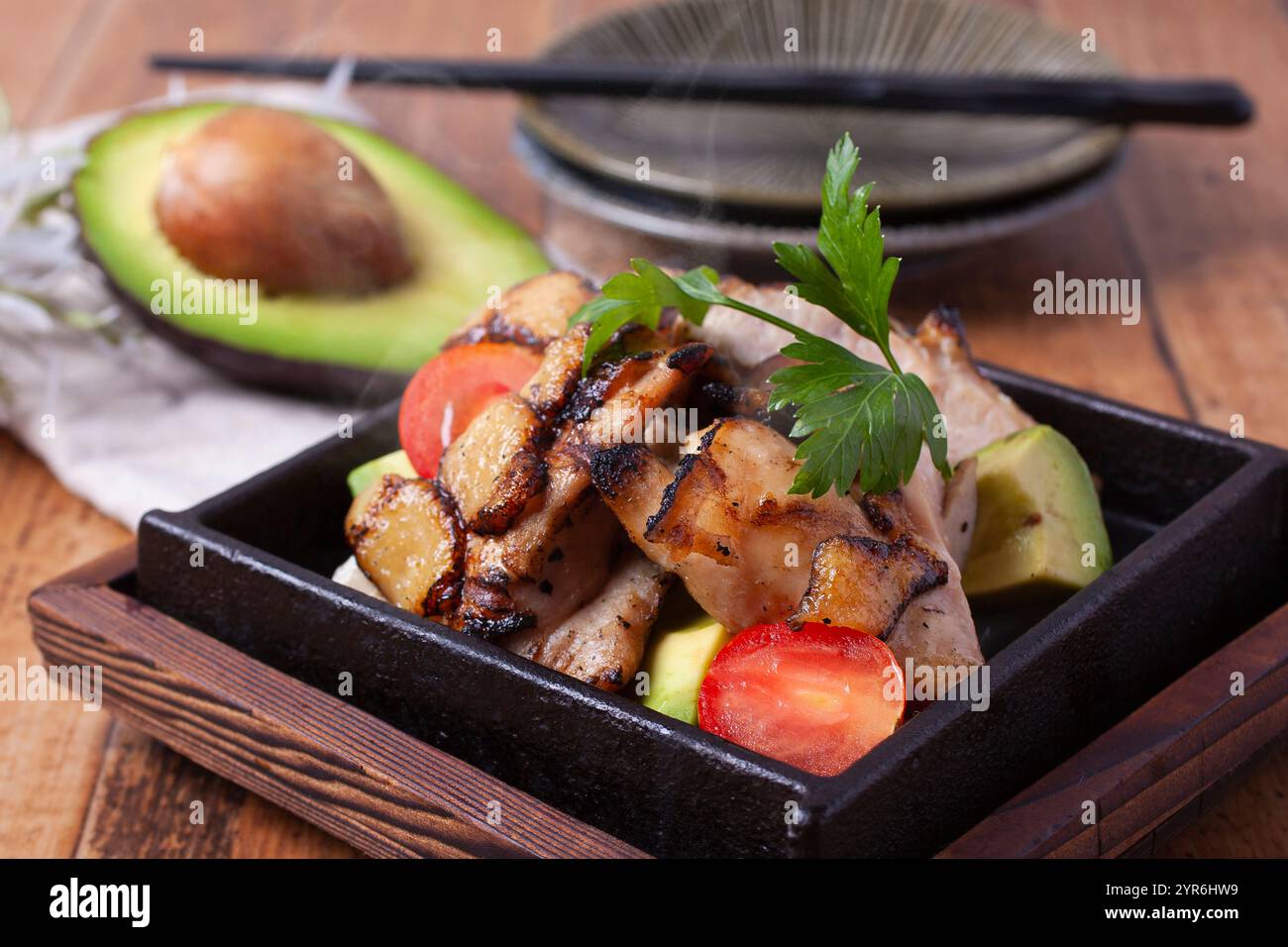 Chicken avocado grilled on teppan Stock Photo - Alamy