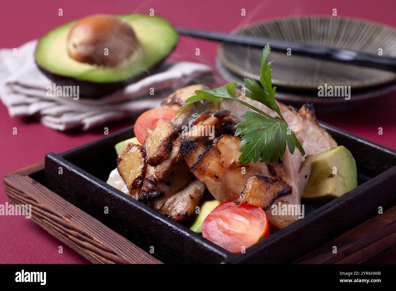 Chicken avocado grilled on teppan Stock Photo - Alamy