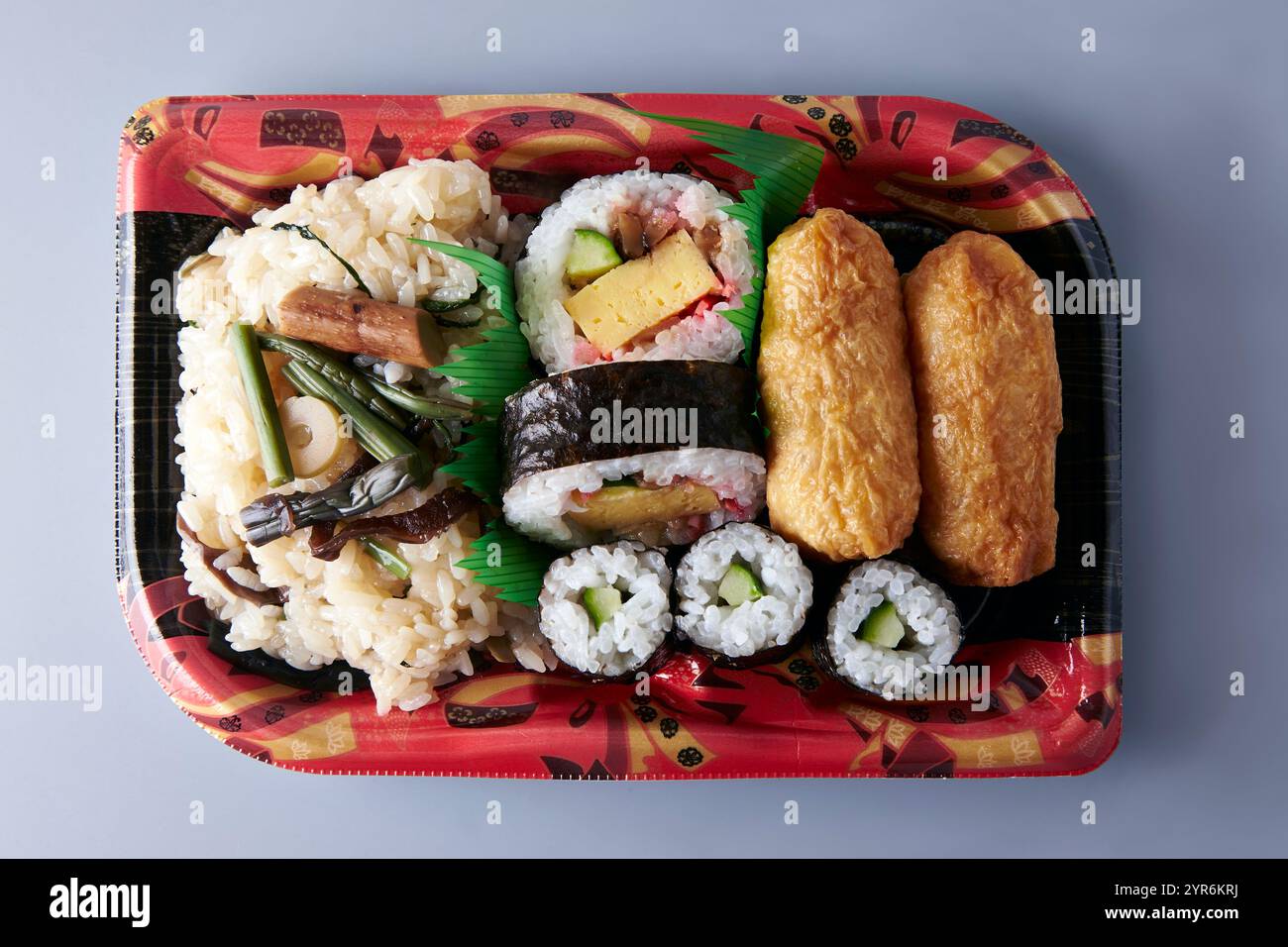 Inari sushi, futomaki and gomoku-gohan Japanese-style lunch box Stock ...