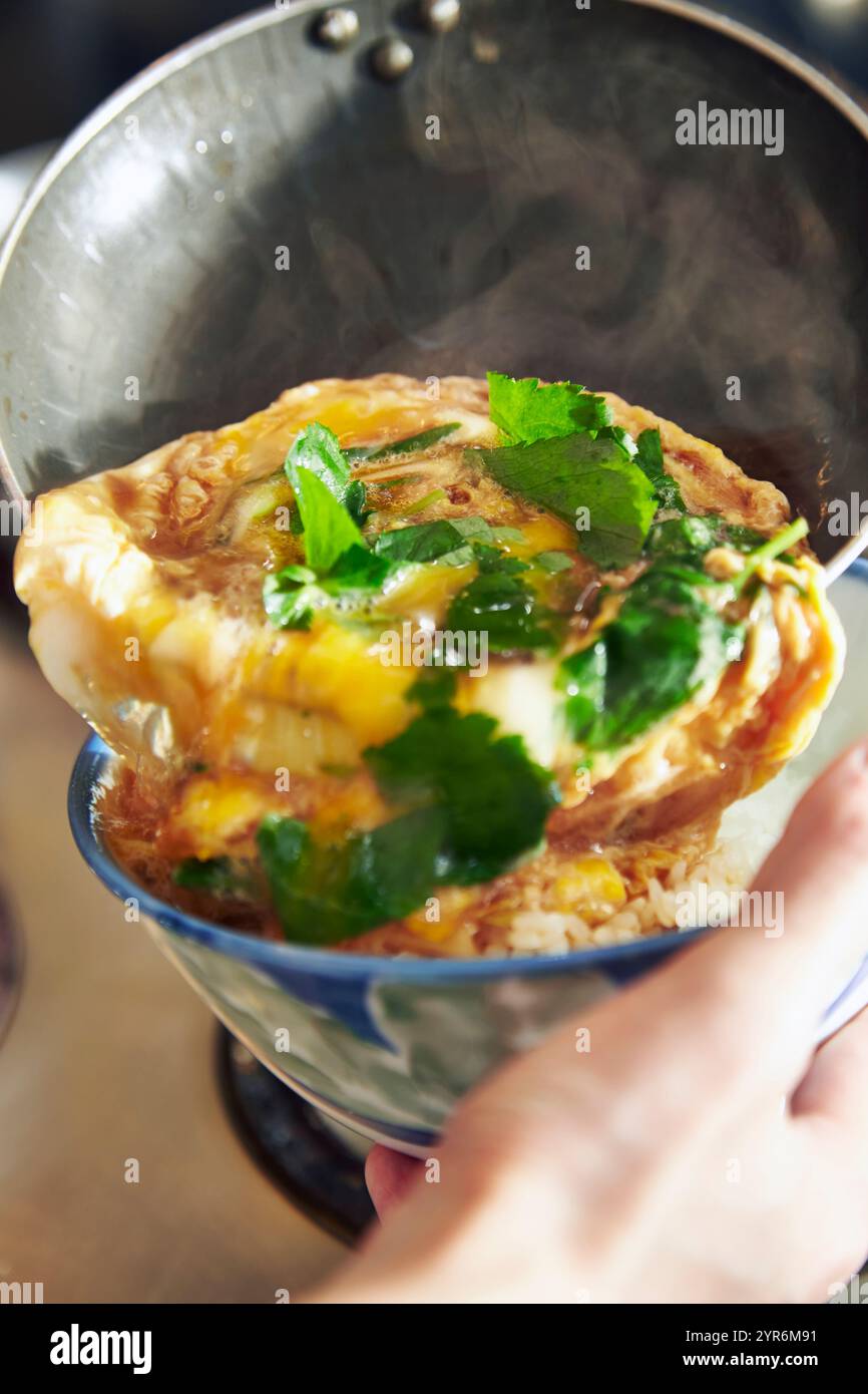 Process photo of serving tamagodon in a bowl Stock Photo - Alamy