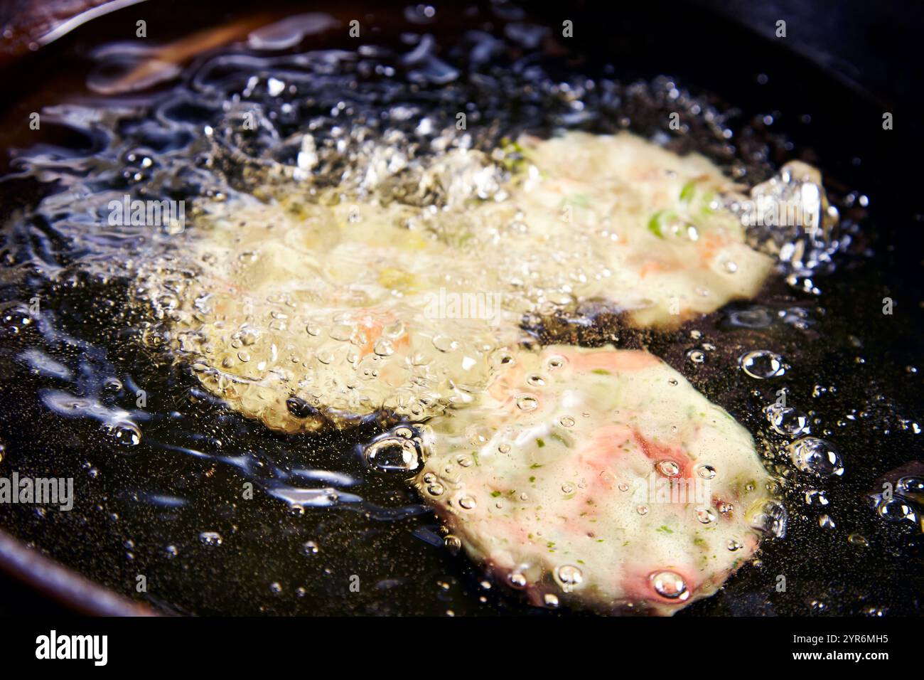 Photo of the process of frying deep-fried fish cakes Stock Photo - Alamy